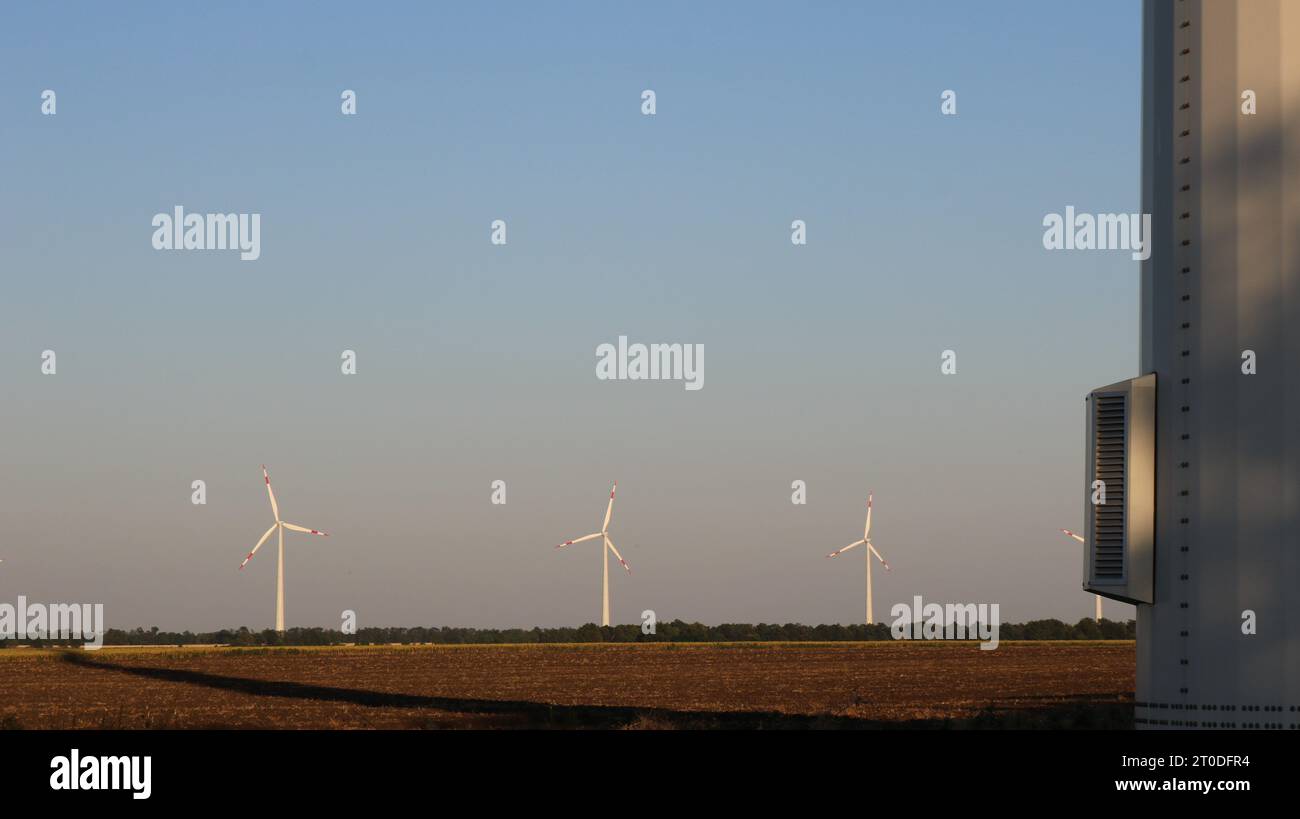 Revolving wind turbine against background hi-res stock photography and ...