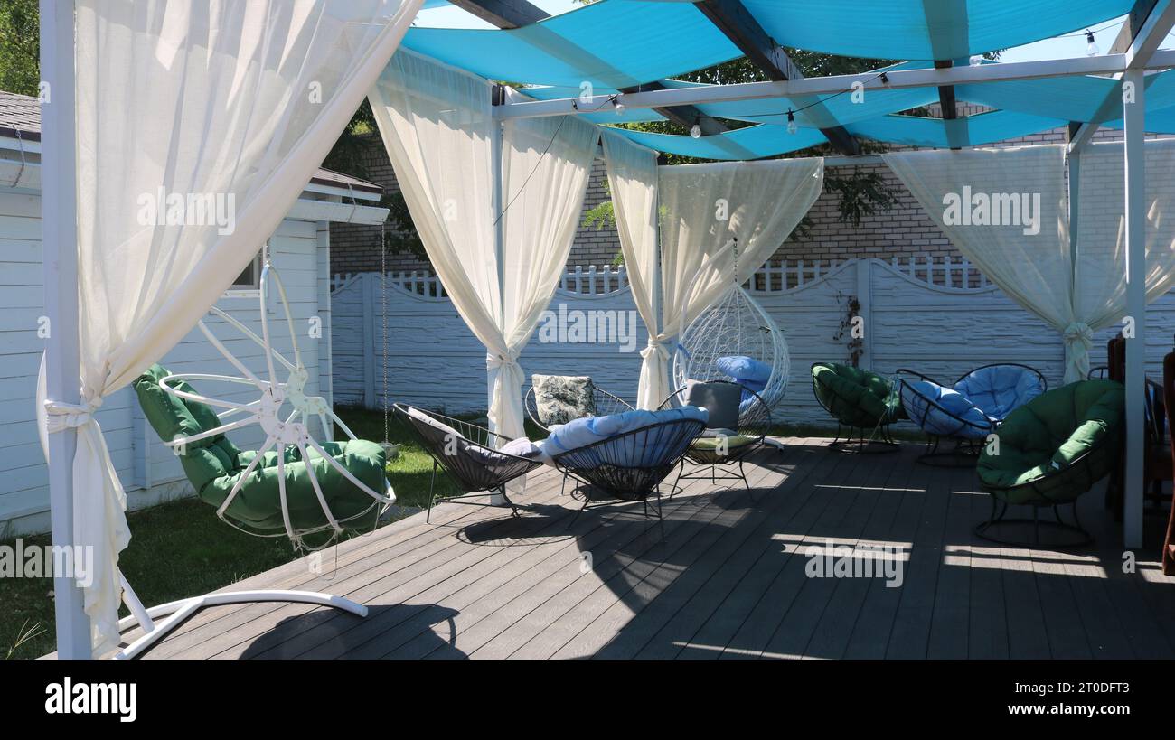 a private relaxation area on the sun terrace with comfortable chairs ...