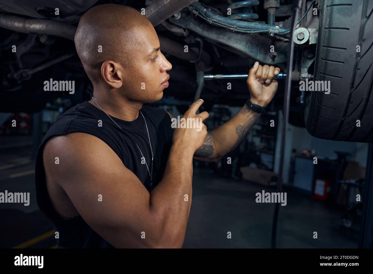 Concentrated auto-mechanic dismantling ball joint mount using open-end ...