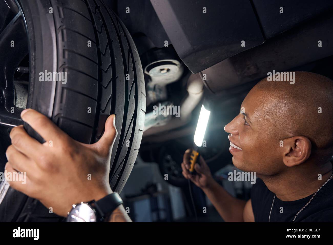 Auto-mechanic finding bent suspension and worn thread of bolt that ...