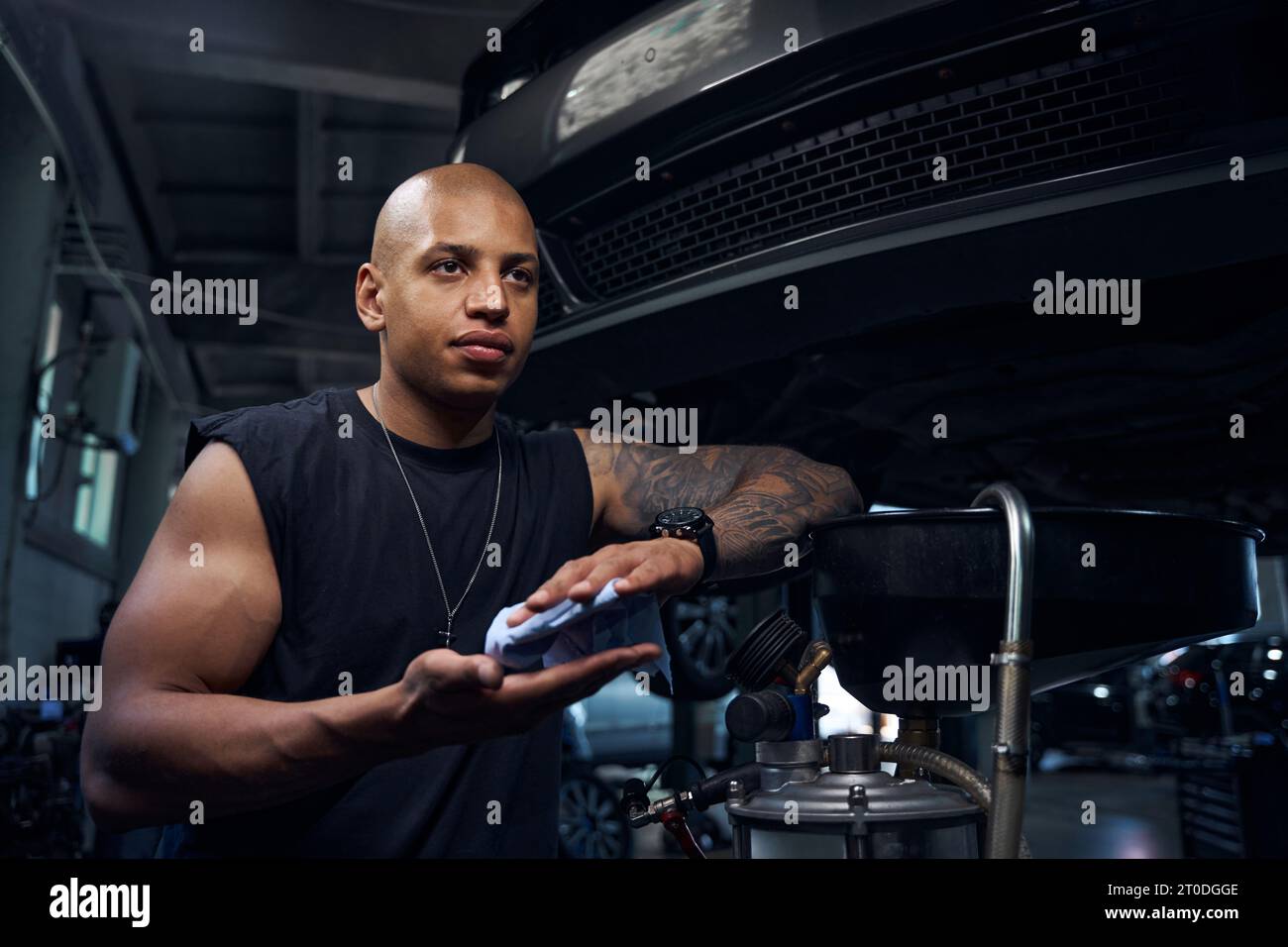 Auto-mechanic cleaning hands after elimination of serious damage Stock ...