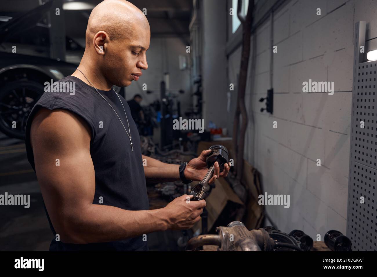 Auto-mechanic repairing and maintaining piston with crank mechanism ...