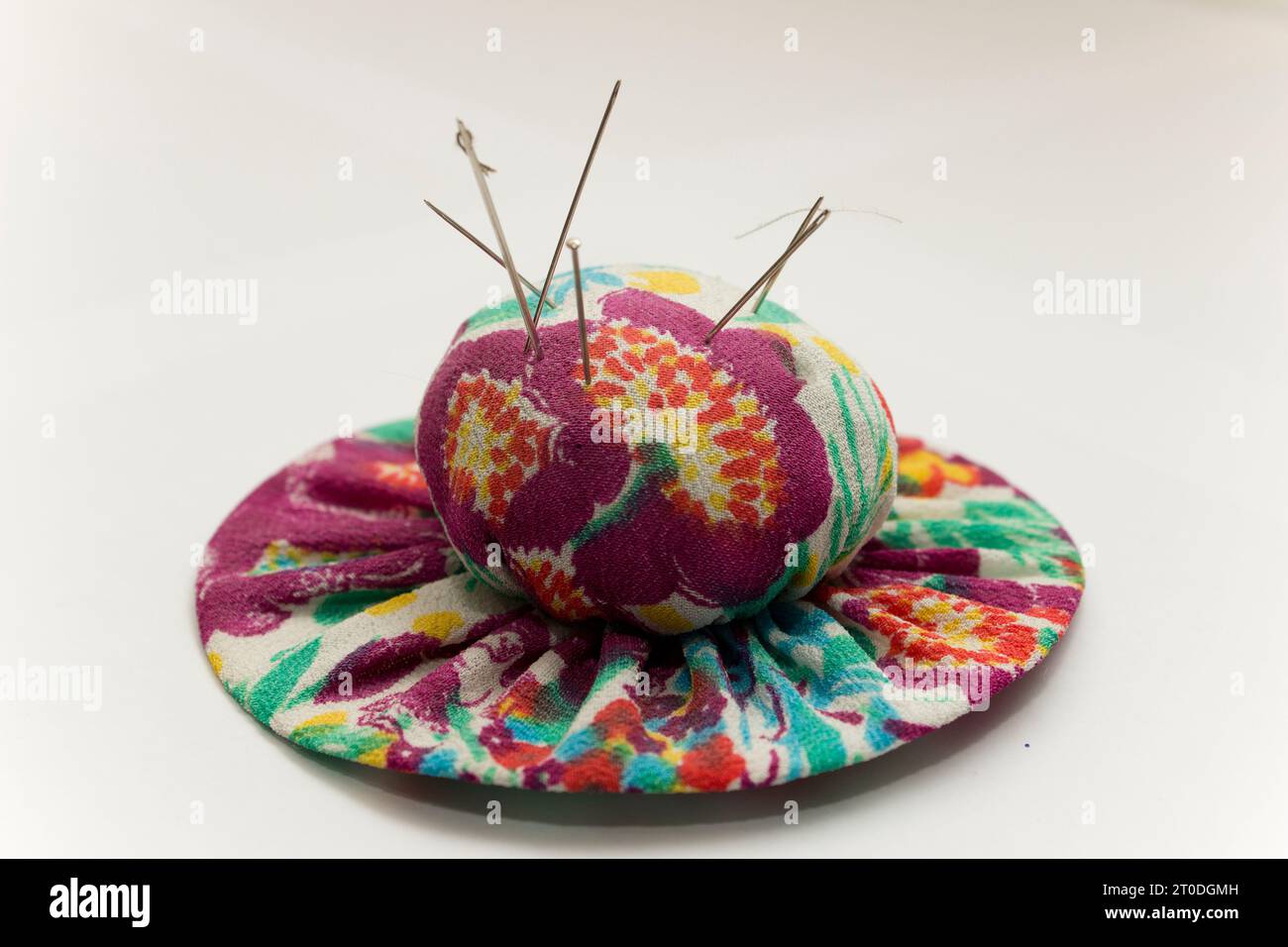 This handmade fabric pin cushion with its vibrant floral pattern and ...
