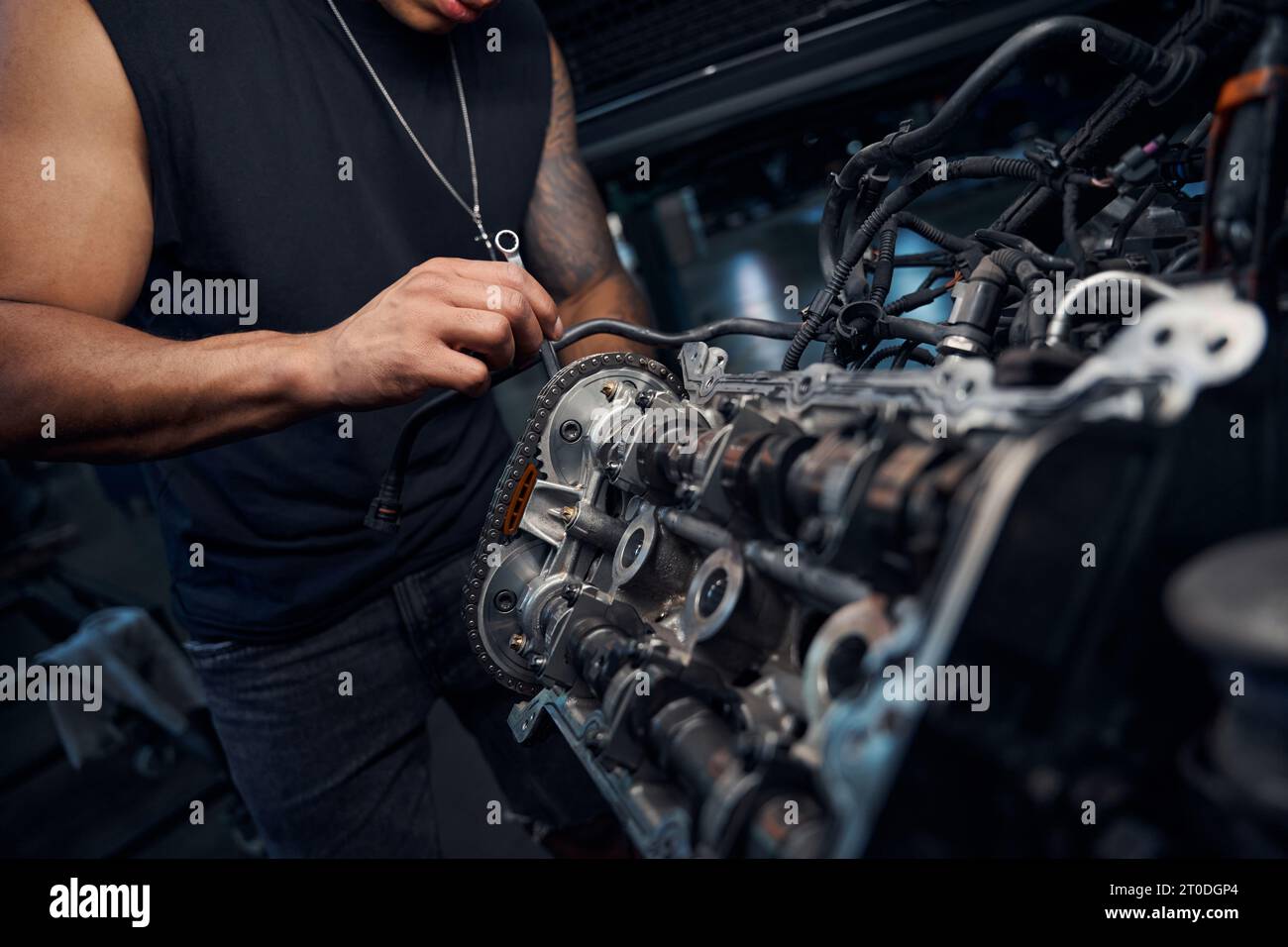 African-American auto-mechanic engaging in car engine repairing Stock ...