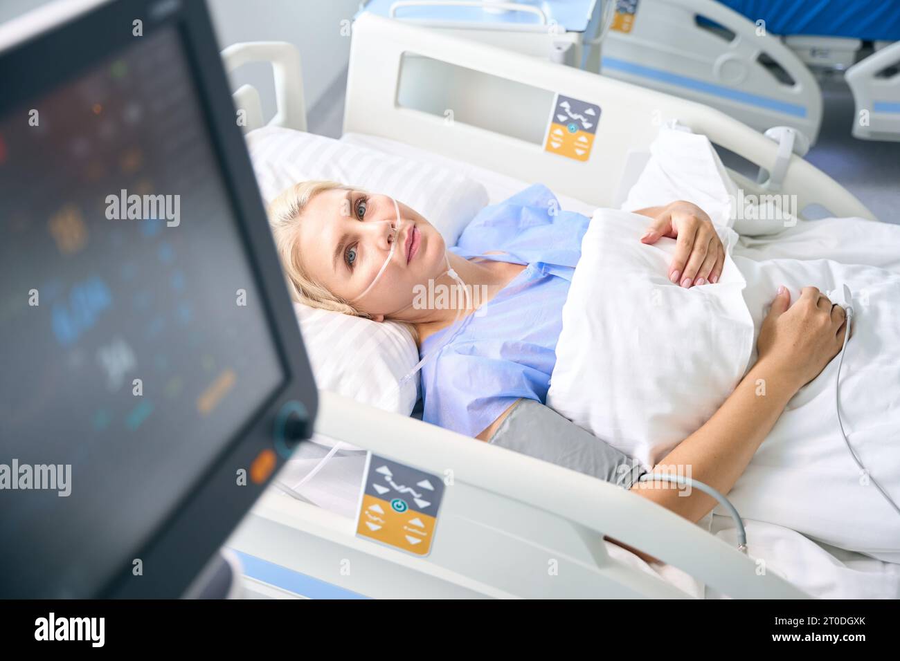 Female after surgery lies in a room with modern equipment Stock Photo ...