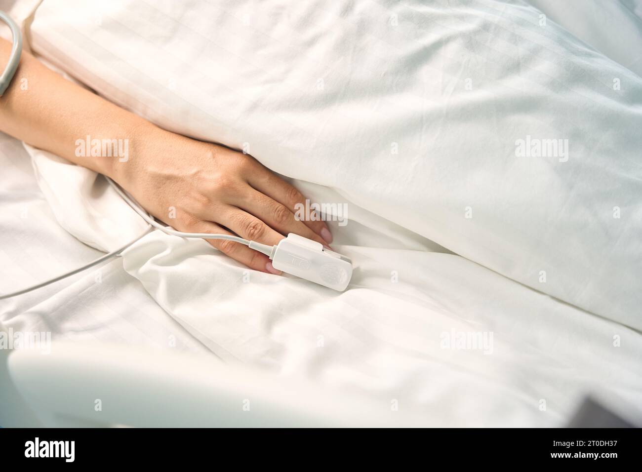 Female hand with a diagnostic sensor on the ring finger Stock Photo - Alamy