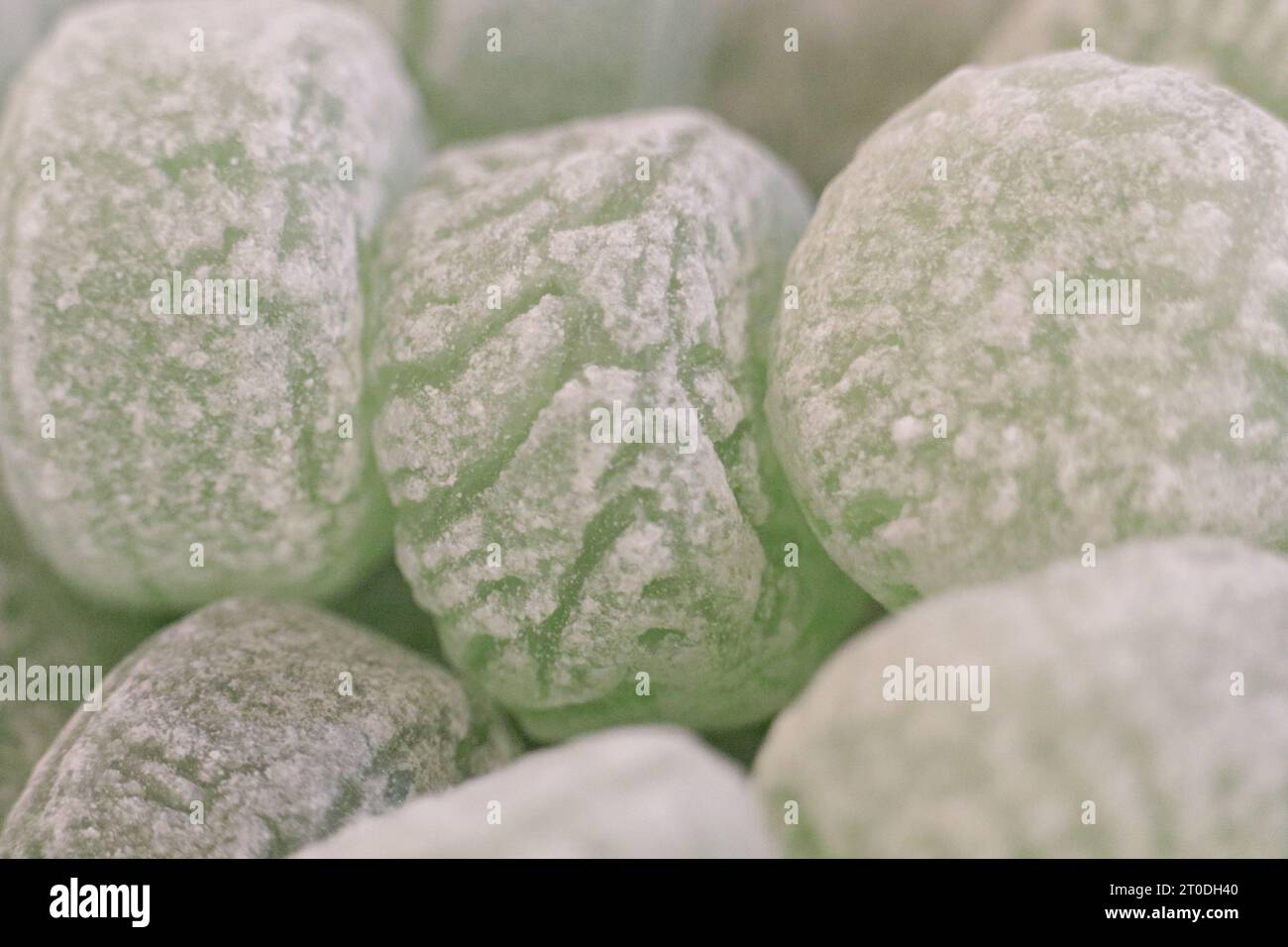 A swirl of green-tinted candy, glistening with sweetness, fills the ...