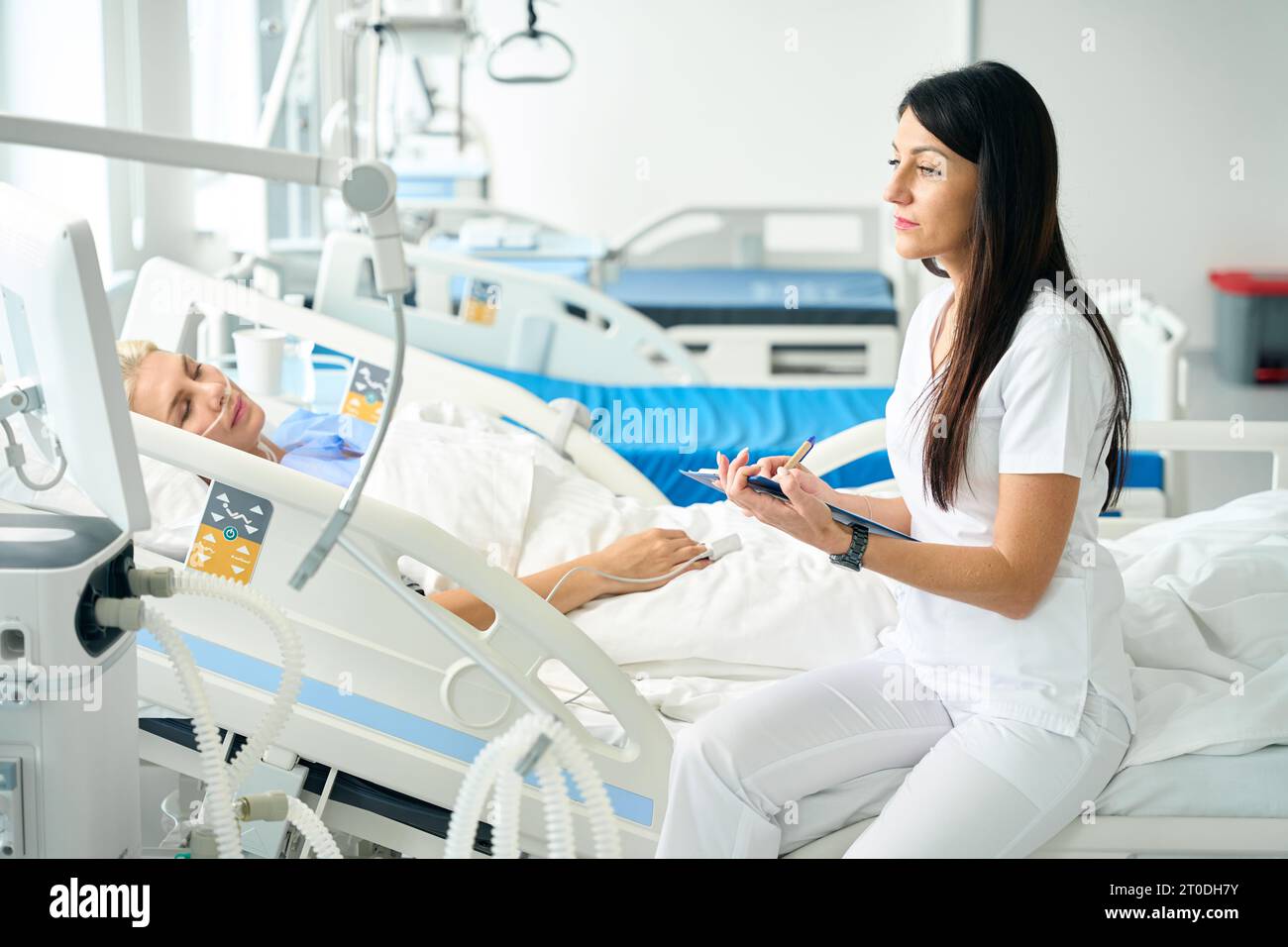 Health worker records the vital signs of a patient Stock Photo - Alamy