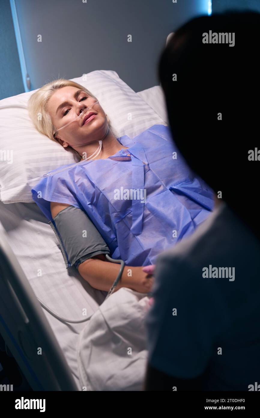 Hospital employee communicates with a patient after surgery Stock Photo ...