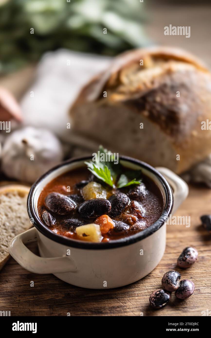 Traditional bean soup made from big beans, smoked neck, potatoes, and ...