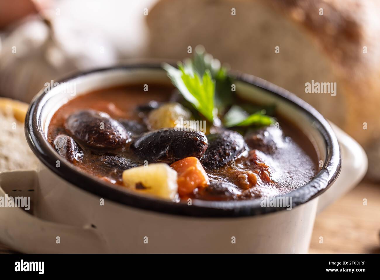 Traditional bean soup made from big beans, smoked neck, potatoes, and ...