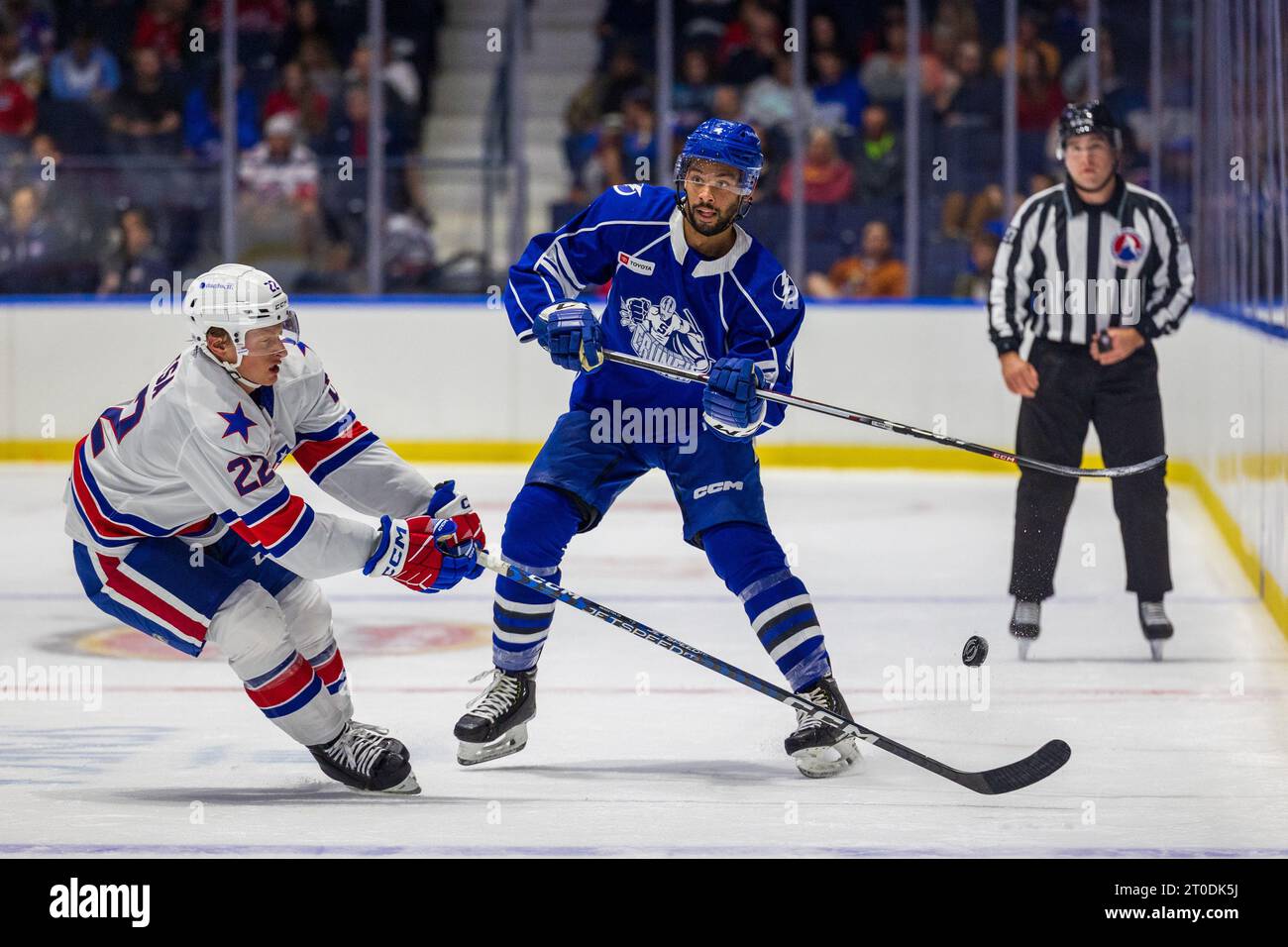 October 5th 2023: Syracuse Crunch defenseman Devante Stephens (4) dumps ...