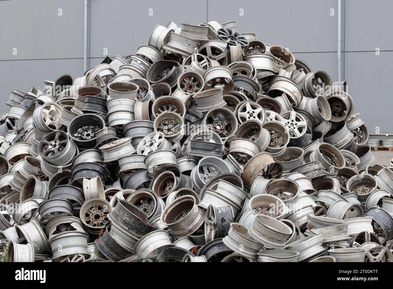 Discarded Aluminum Wheels in Recycling Industry. Stack of old discarded ...