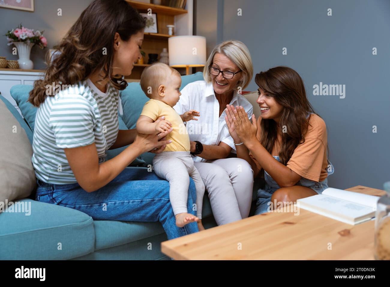 Grandmother, mother and baby in home for playing, quality time and ...