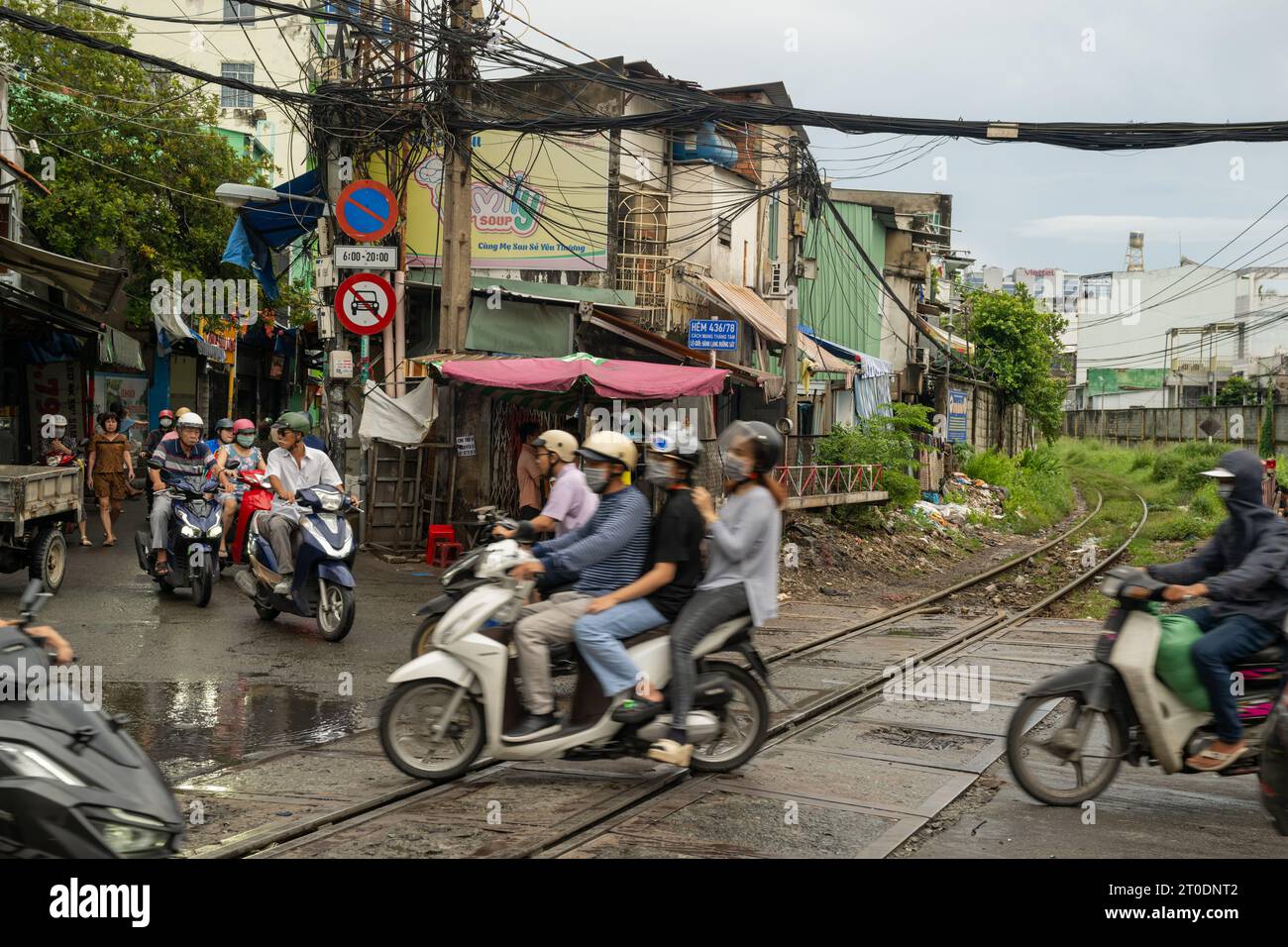 Passing motorcycles at the famous Saigon Level Crossing, Ho Chi Minh ...