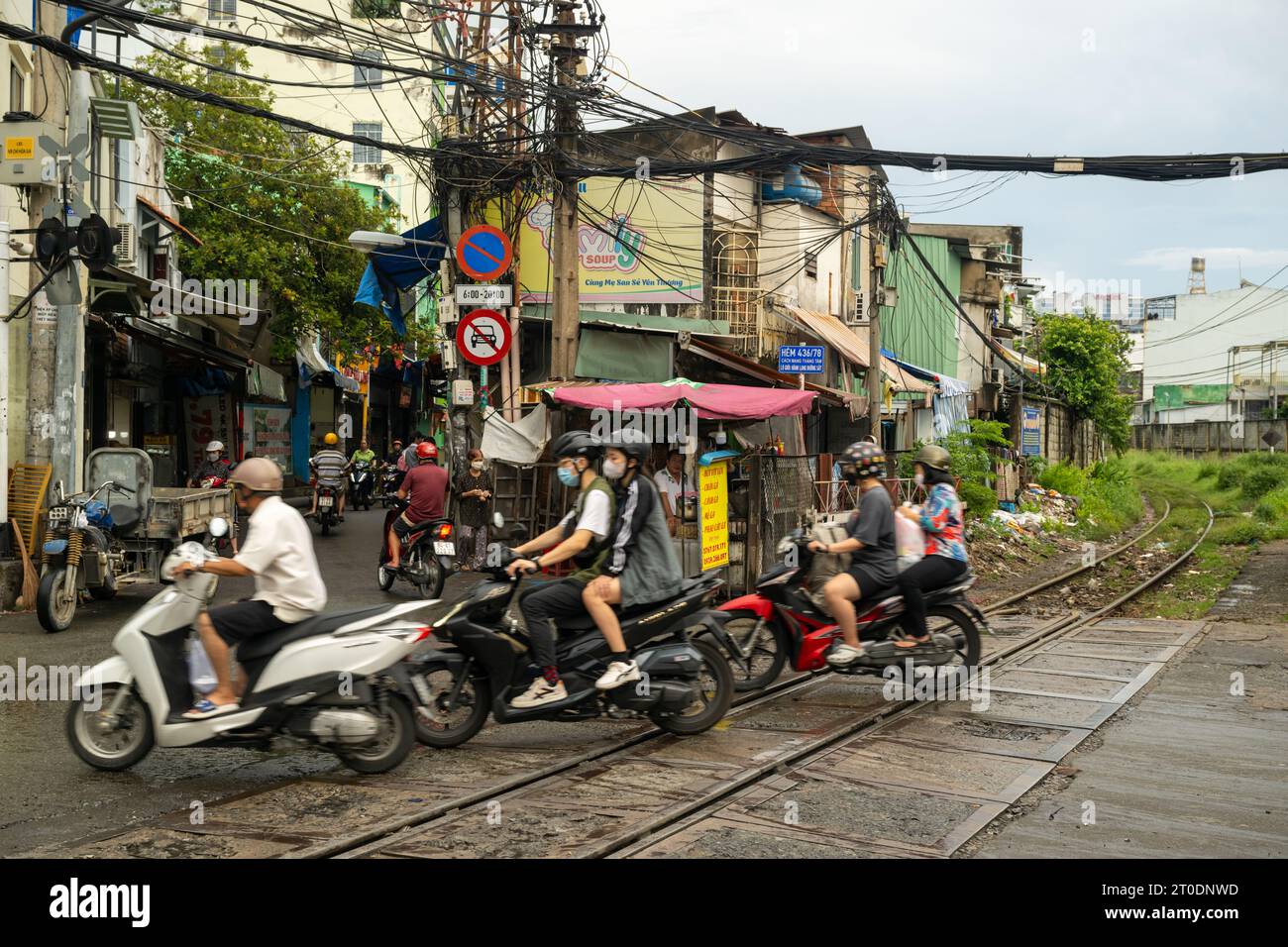 Passing motorcycles at the famous Saigon Level Crossing, Ho Chi Minh ...