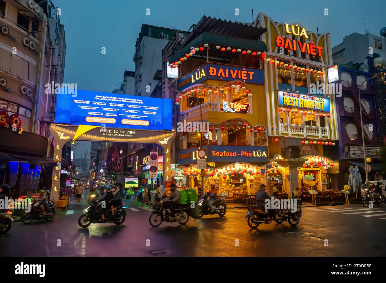 Illuminated front entrance to the Bui Vien Walking Street at night, Ho Chi Minh City, Vietnam ...