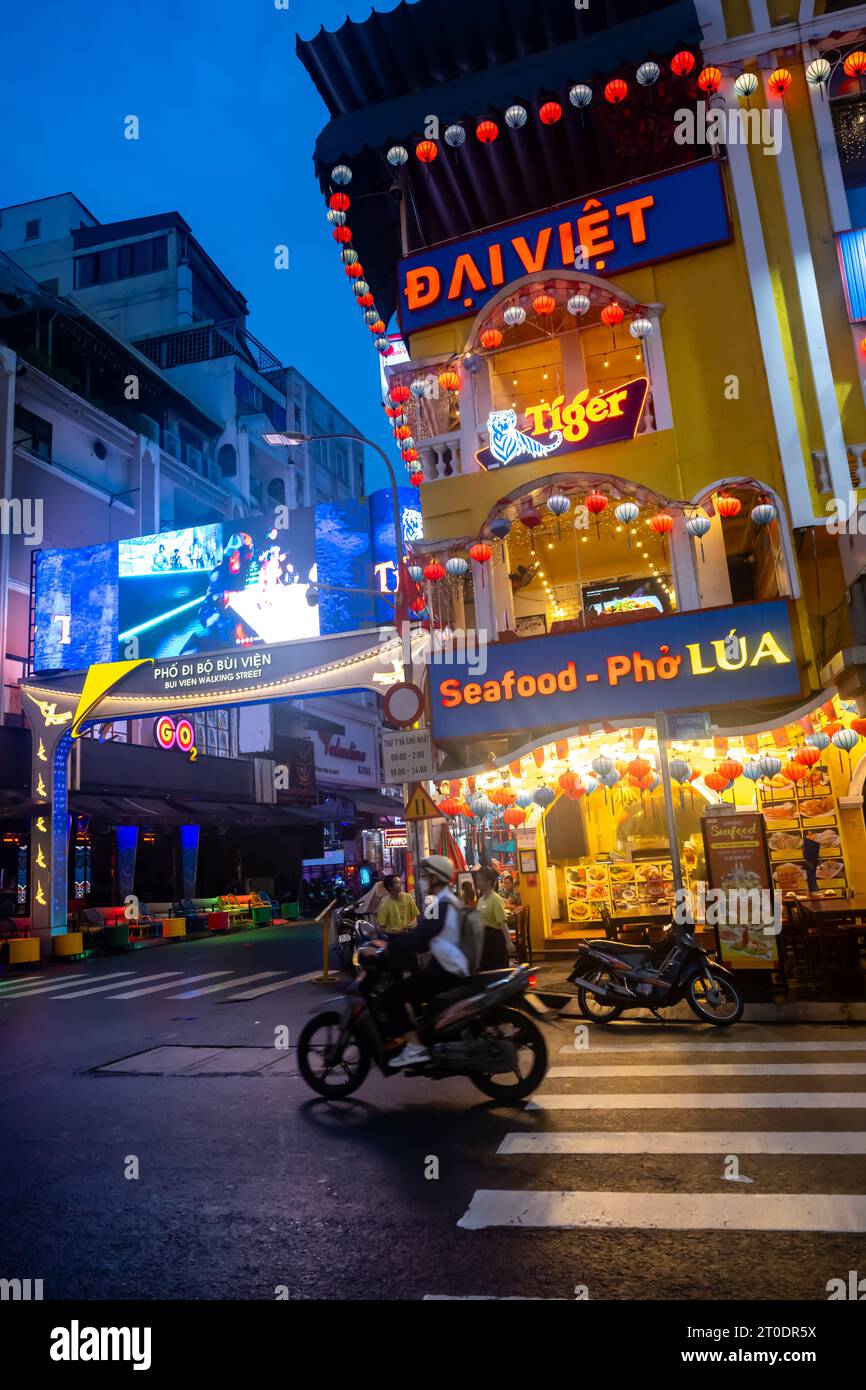 Illuminated front entrance to the Bui Vien Walking Street at night, Ho Chi Minh City, Vietnam ...