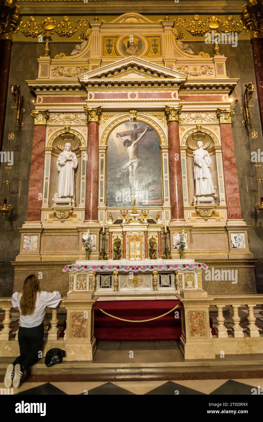 Woman praying, Side altar in the iconic St Stephen’s Basilica, Budapest ...