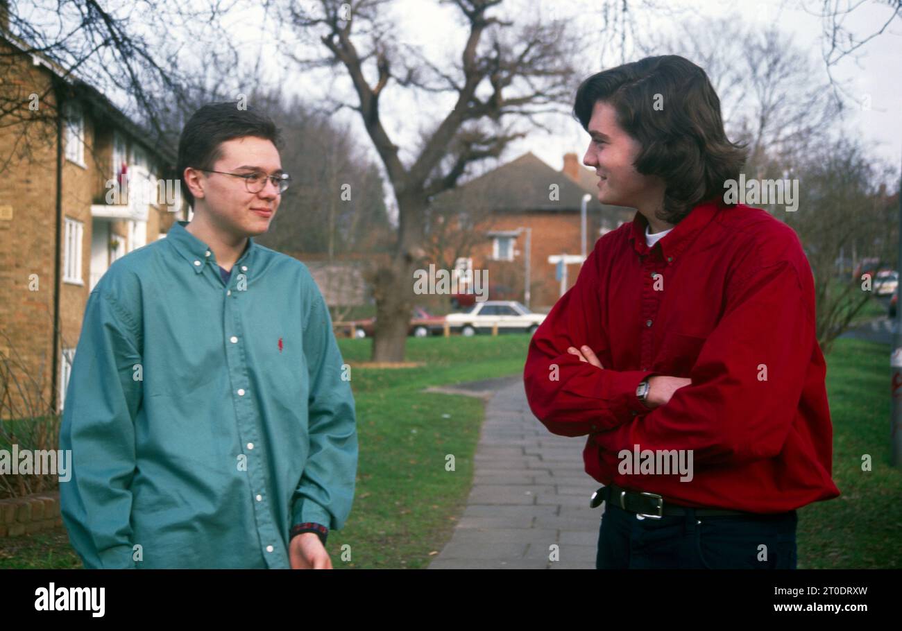 Two boys talking street hi-res stock photography and images - Alamy