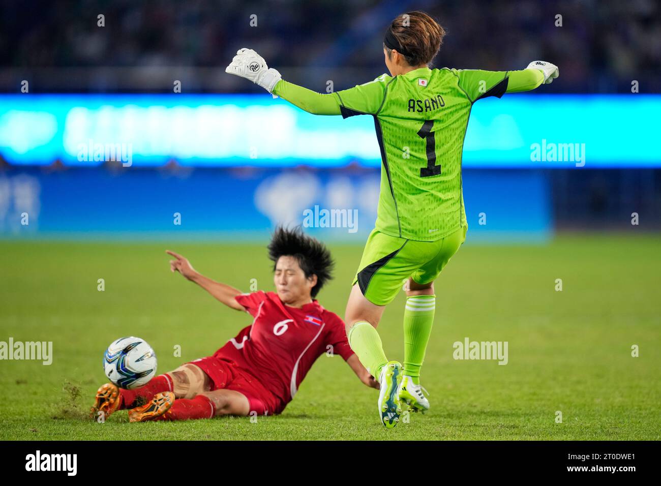 North Korea's Yujong Myong takes a shot against Japan's goalkeeper ...