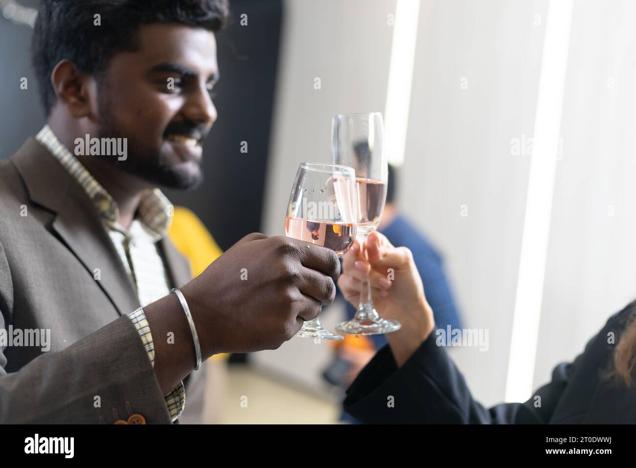 Making a toast, Cheers !! An Indian businessman and colleagues having ...