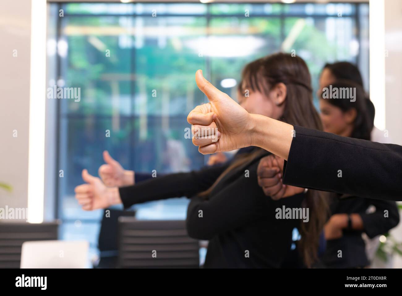 Group of diversity workers showing their confident, thumbs up posture ...