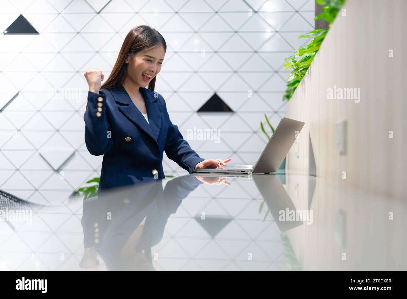 An attractive Asian businesswoman girl expressing a winning moment ...