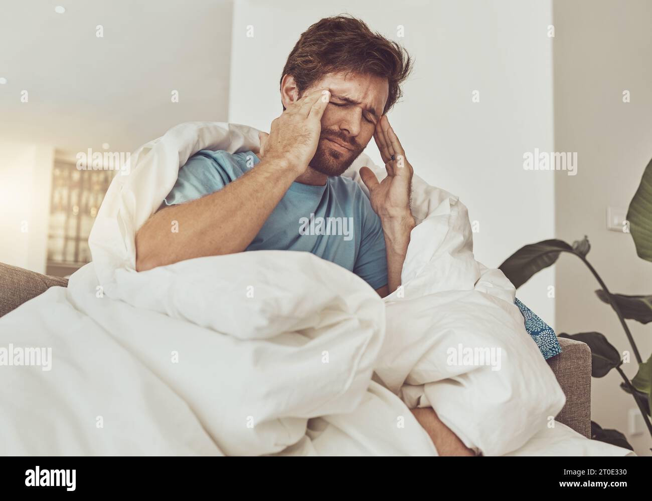 Stress, headache and sick man on a sofa with burnout, vertigo or pain ...
