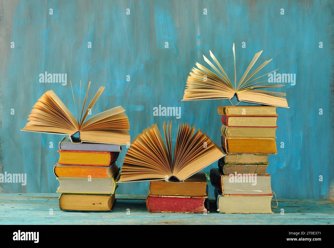 Stack of books with 3 open books, international book fair, reading ...