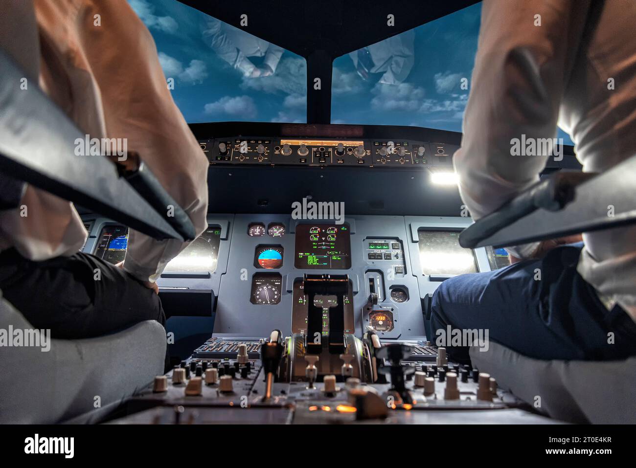 pilots in a cockpit in an airplane during flight Stock Photo - Alamy