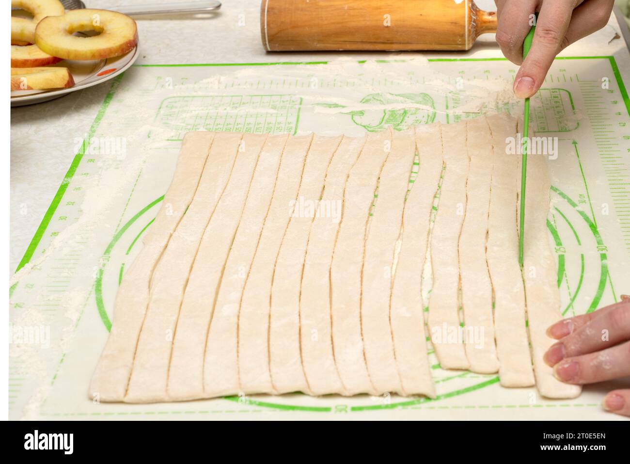 Cutting puff pastry strips hi-res stock photography and images - Alamy
