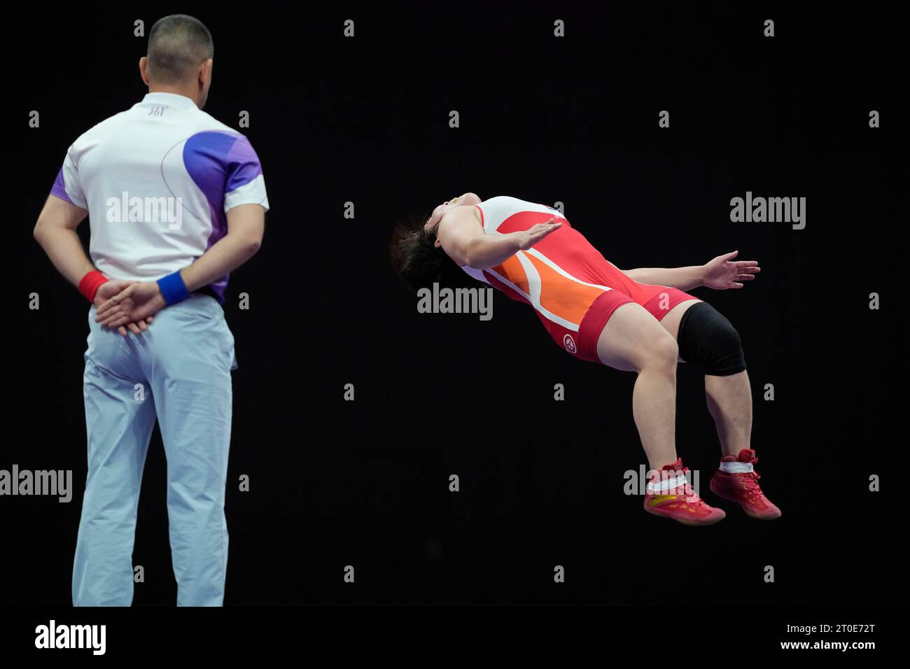 North Korea's Mun Hyongyong flips as she celebrates her win over Japan ...