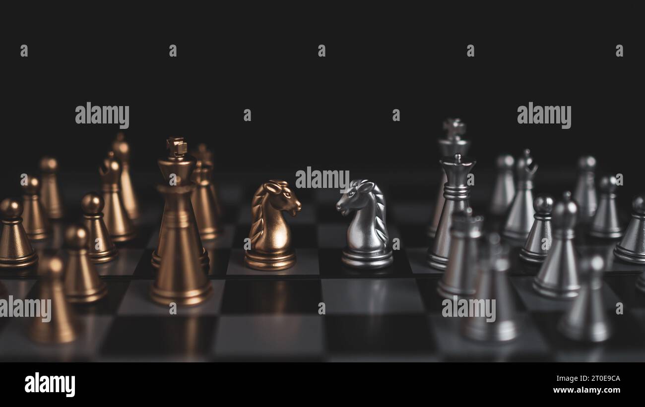 Gold and silver chess pieces in chess board game for business ...