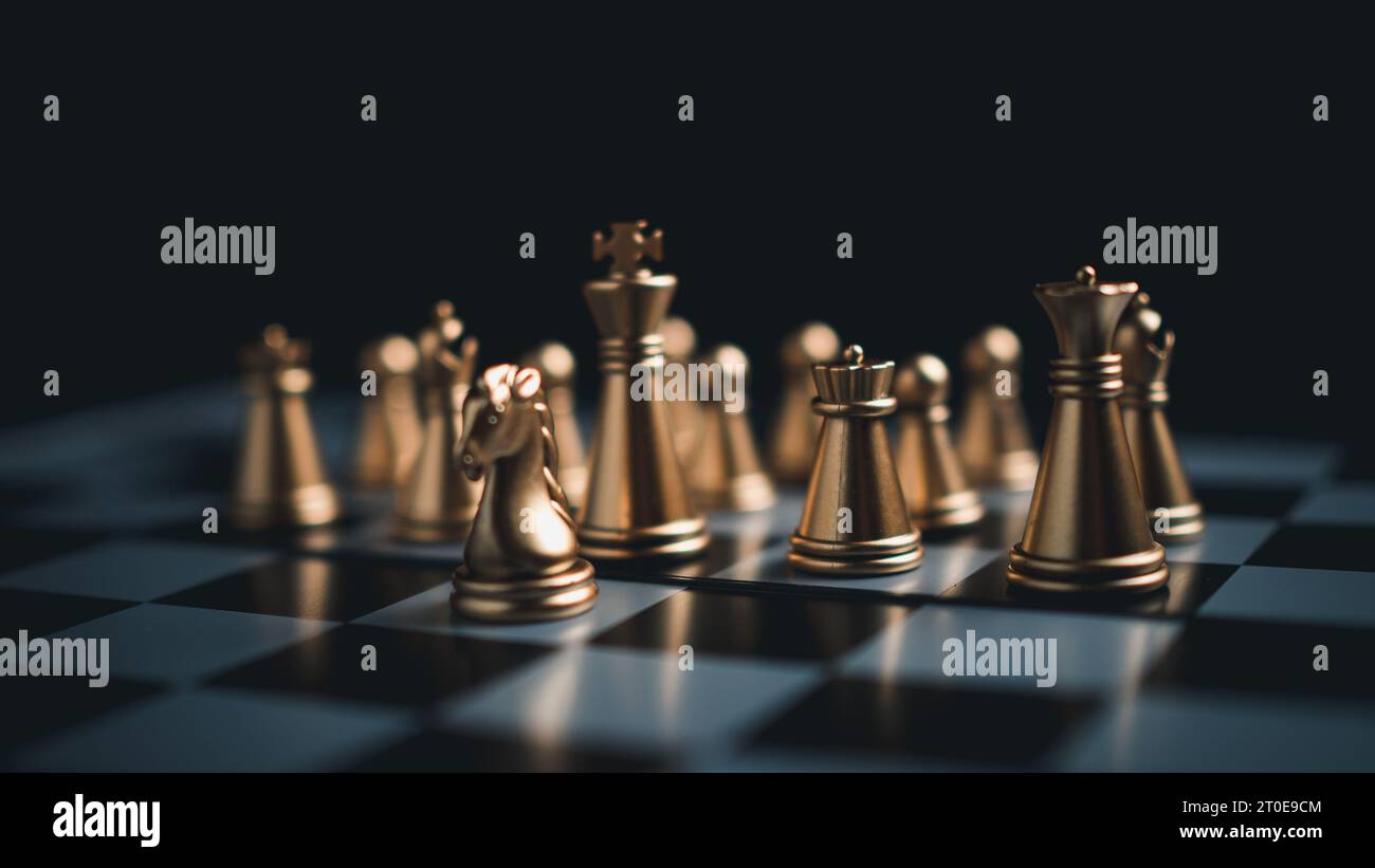 Gold and silver chess pieces in chess board game for business ...
