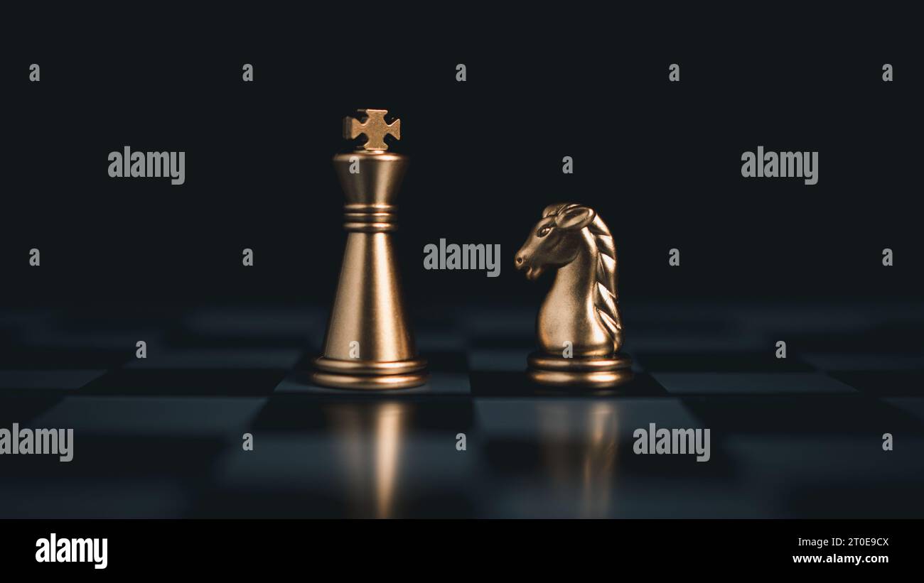 Gold and silver chess pieces in chess board game for business ...