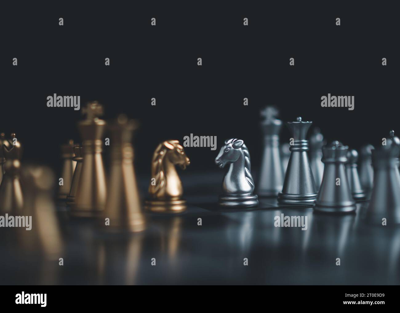Gold and silver chess pieces in chess board game for business ...