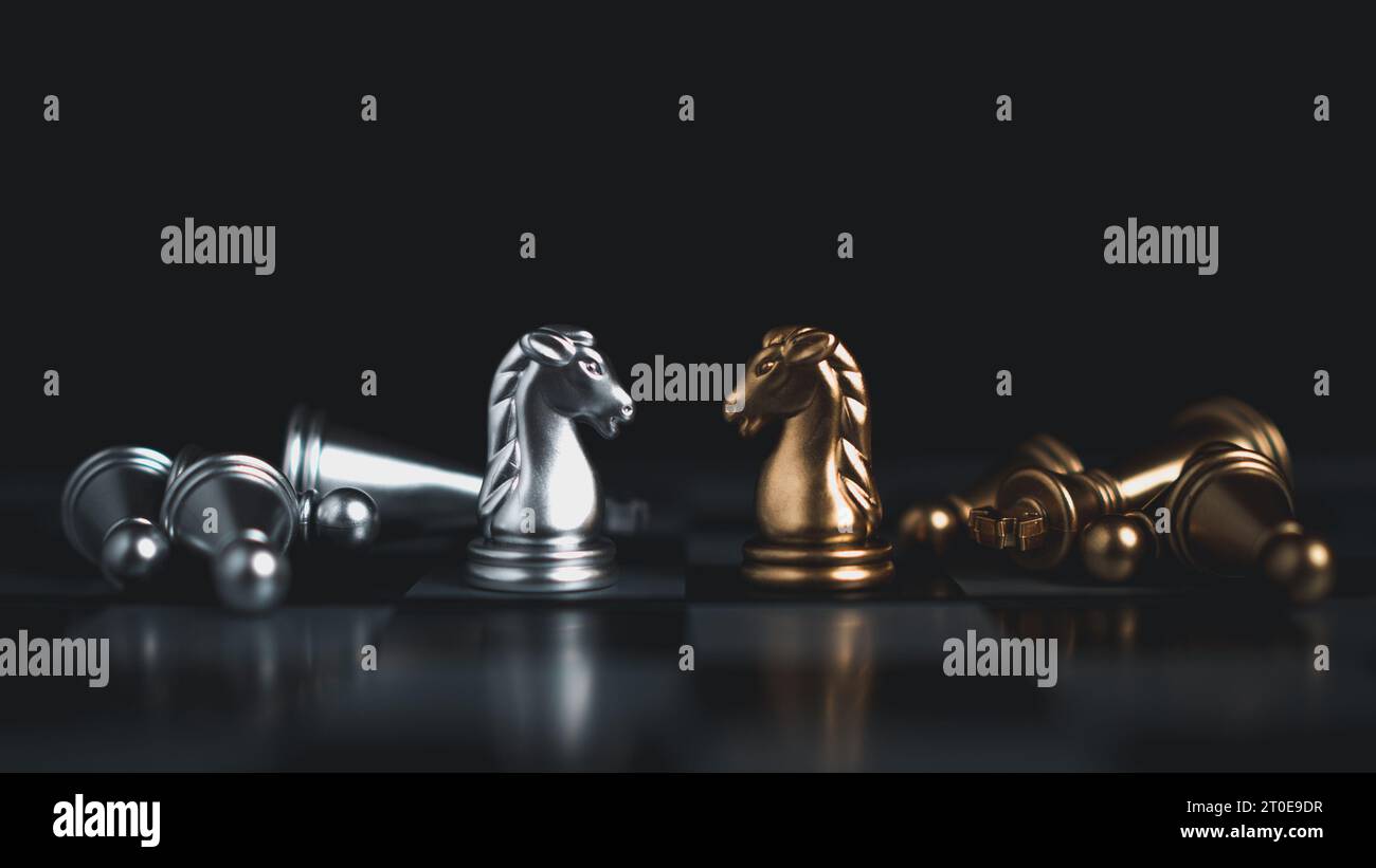 Gold and silver chess pieces in chess board game for business ...