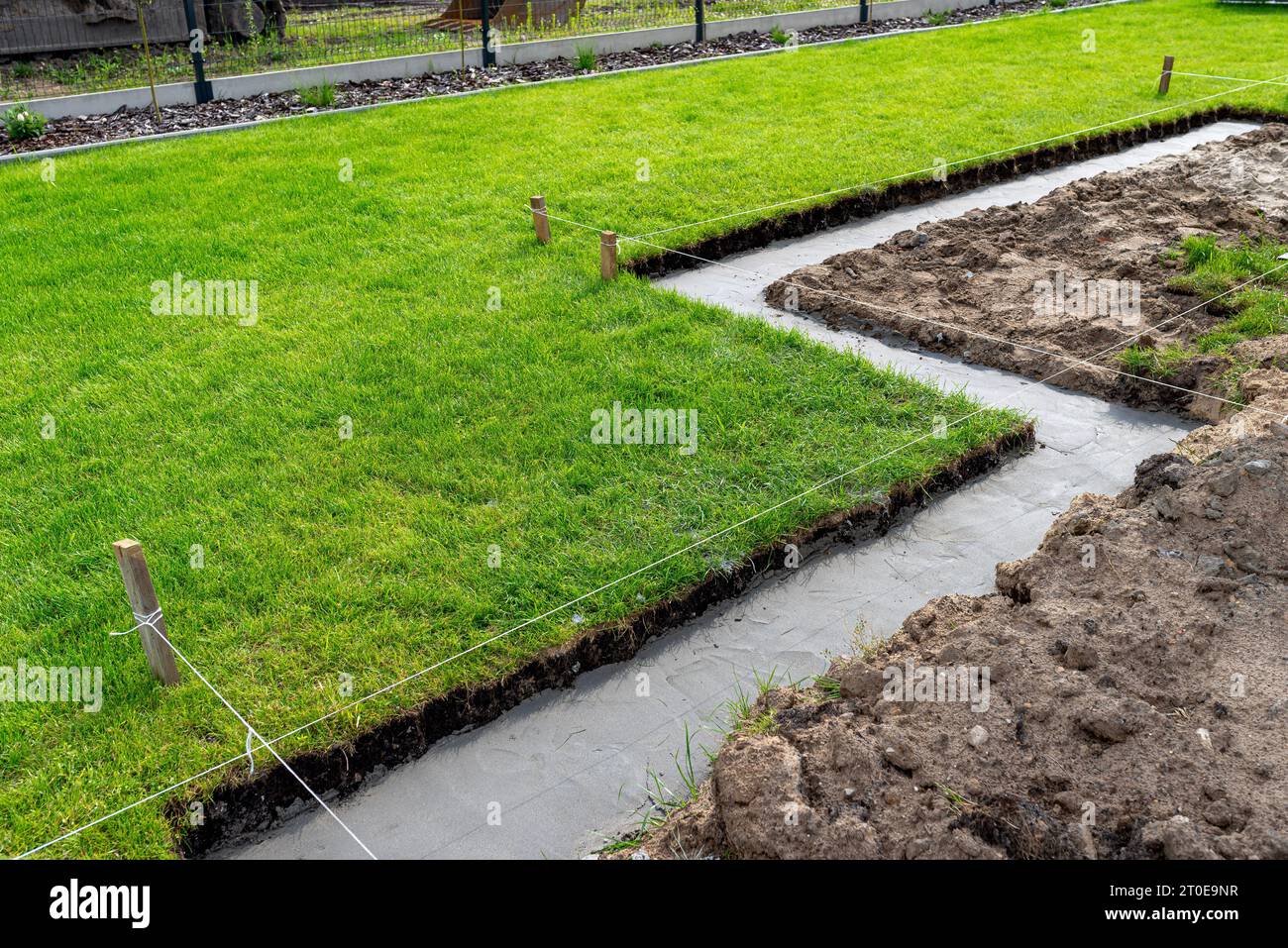 Foundation footings poured in a ditch in the yard, building a terrace ...