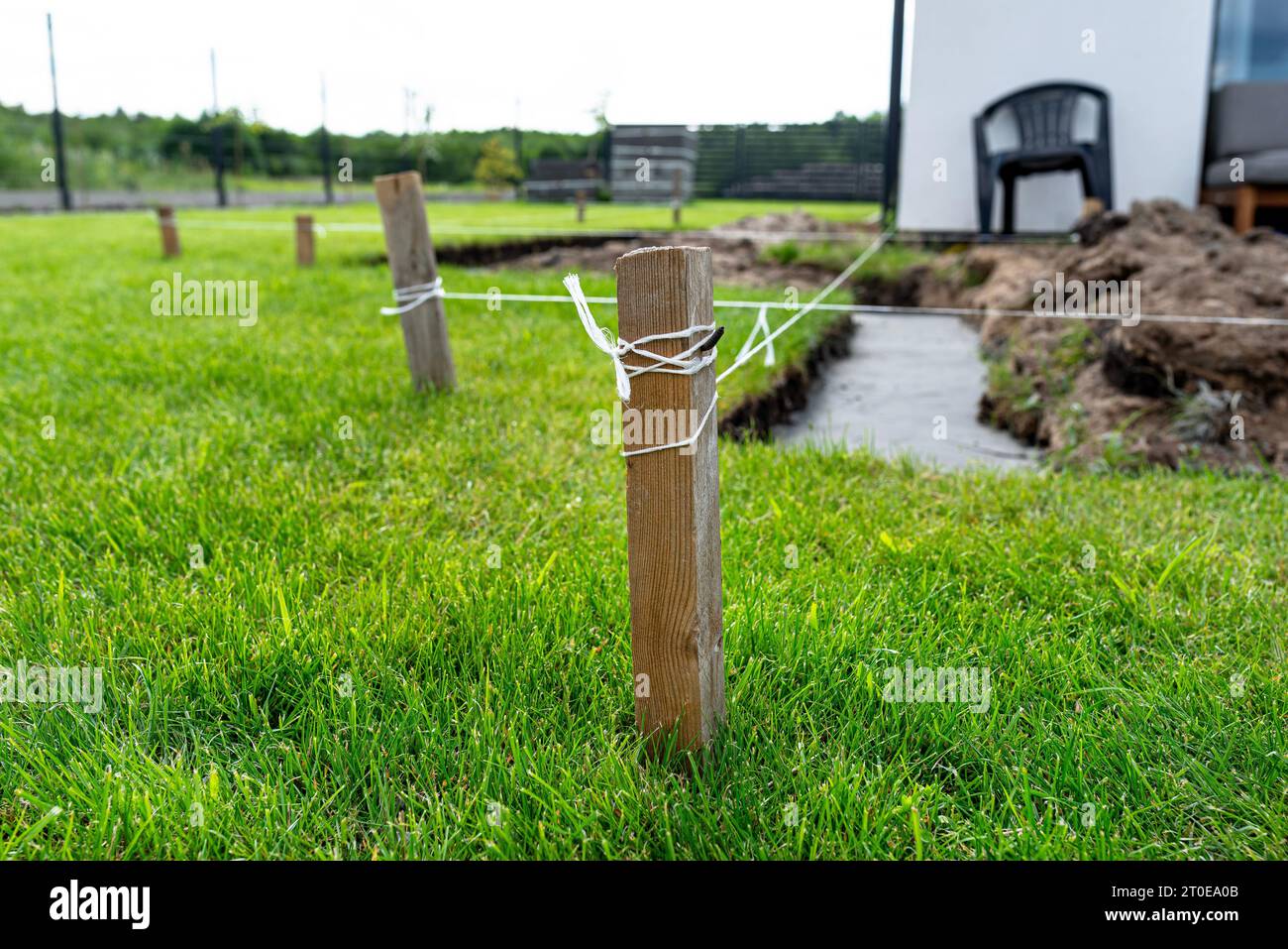 Foundation footings poured in a ditch in the yard, building a terrace ...