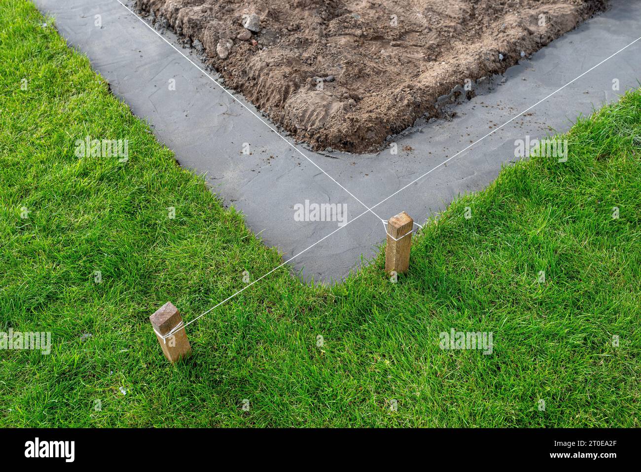 Foundation footings poured in a ditch in the yard, building a terrace ...