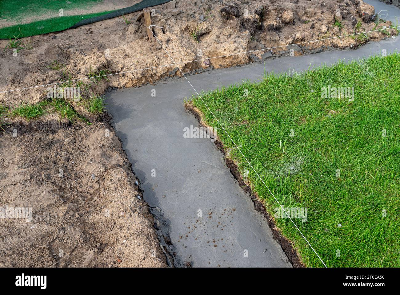 Foundation footings poured in a ditch in the yard, building a terrace ...