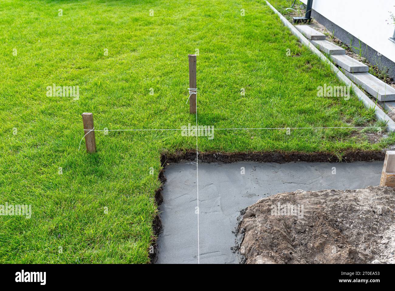 Foundation footings poured in a ditch in the yard, building a terrace ...