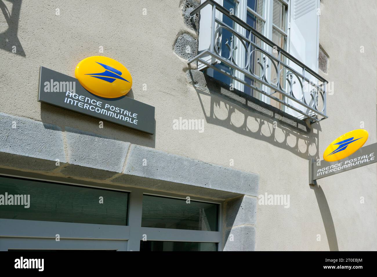 French Postal Agency Sign With Yellow and Blue Logo on Building Wall ...