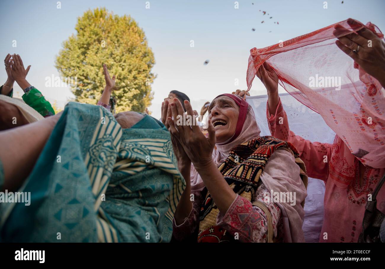 Muslim devotees cry while raising hands as they pray upon seeing the ...