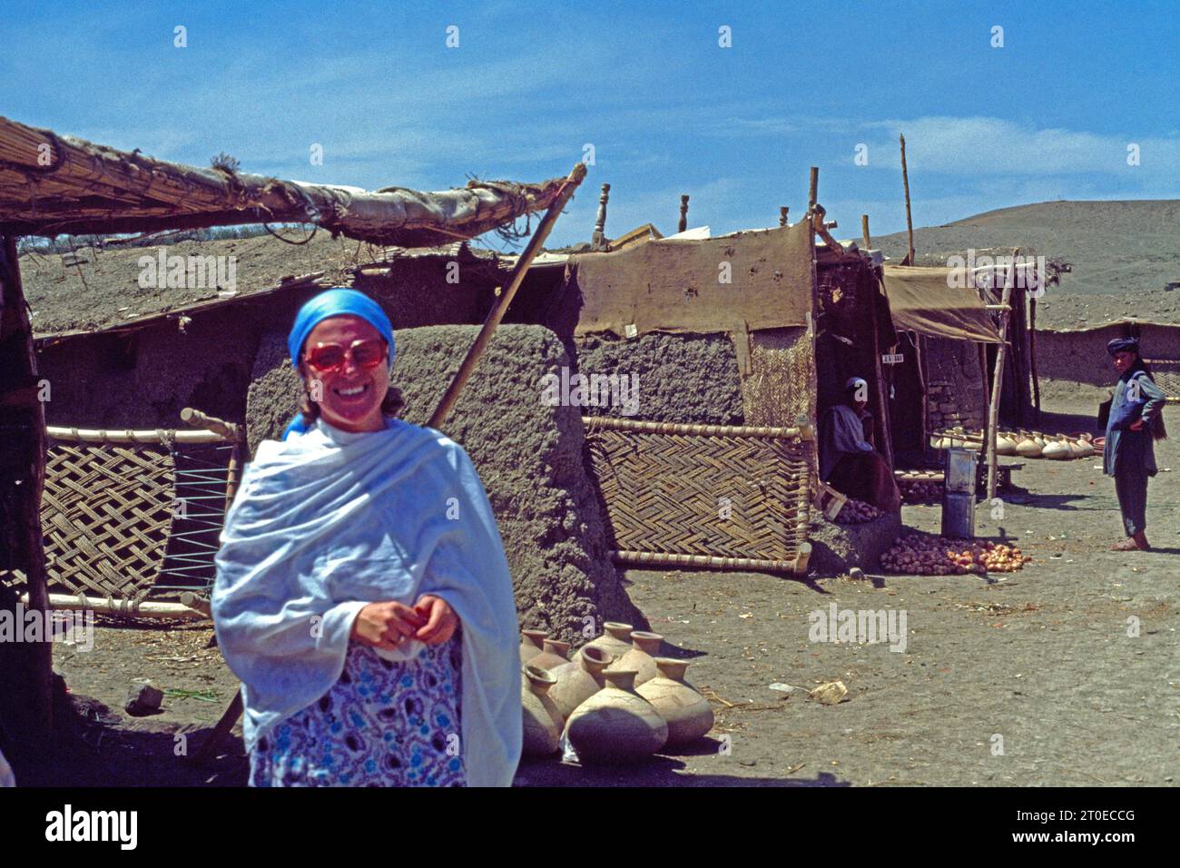 Afghanistan Refugee Camp Woman outside hut Stock Photo - Alamy