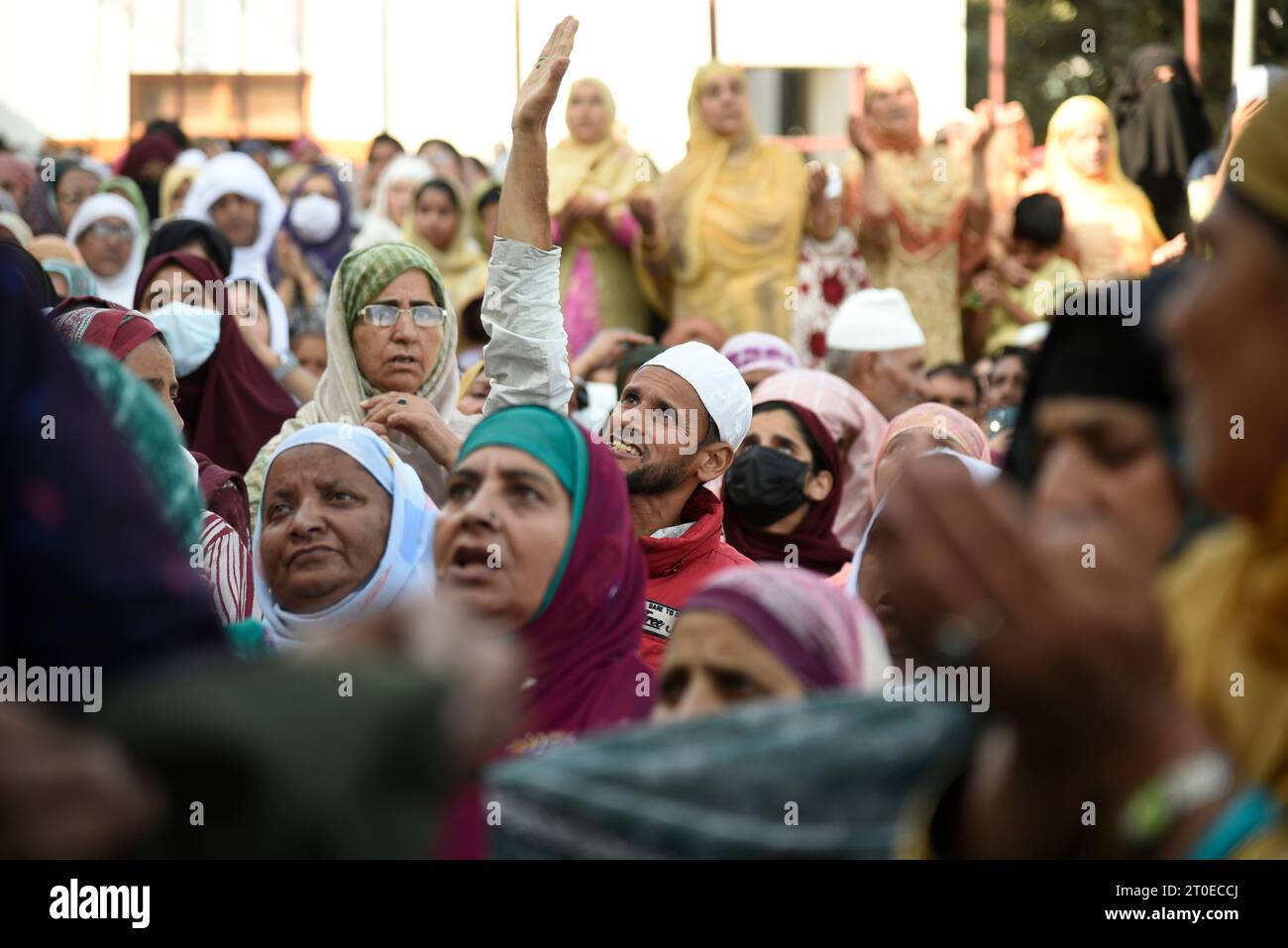 Muslim devotees raise hands as they pray upon seeing the holic relic in ...