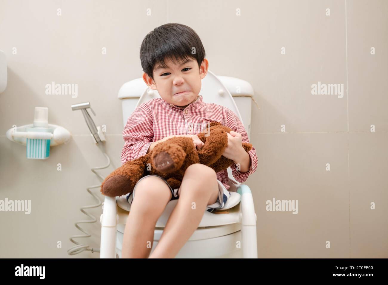 Boy sitting toilet hi-res stock photography and images - Alamy