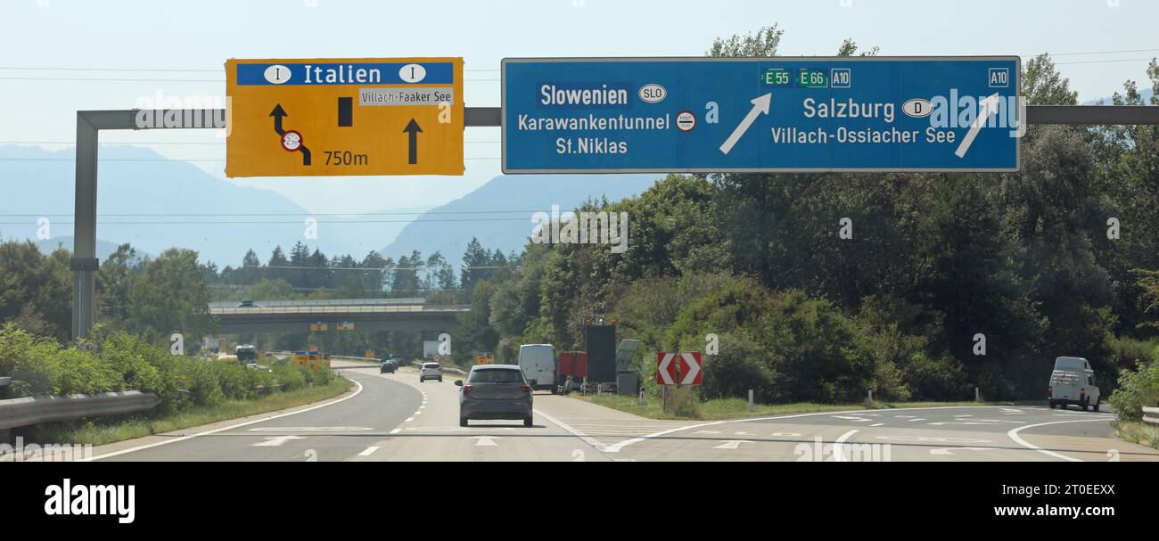 road sign on the highway with the Austrian towns and the Italian border ...