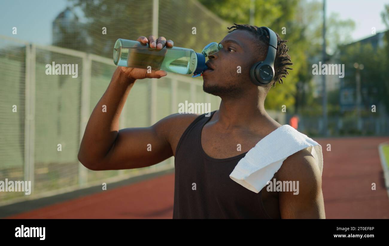 Tired African American sport man male muscular sportsman runner athlete ...